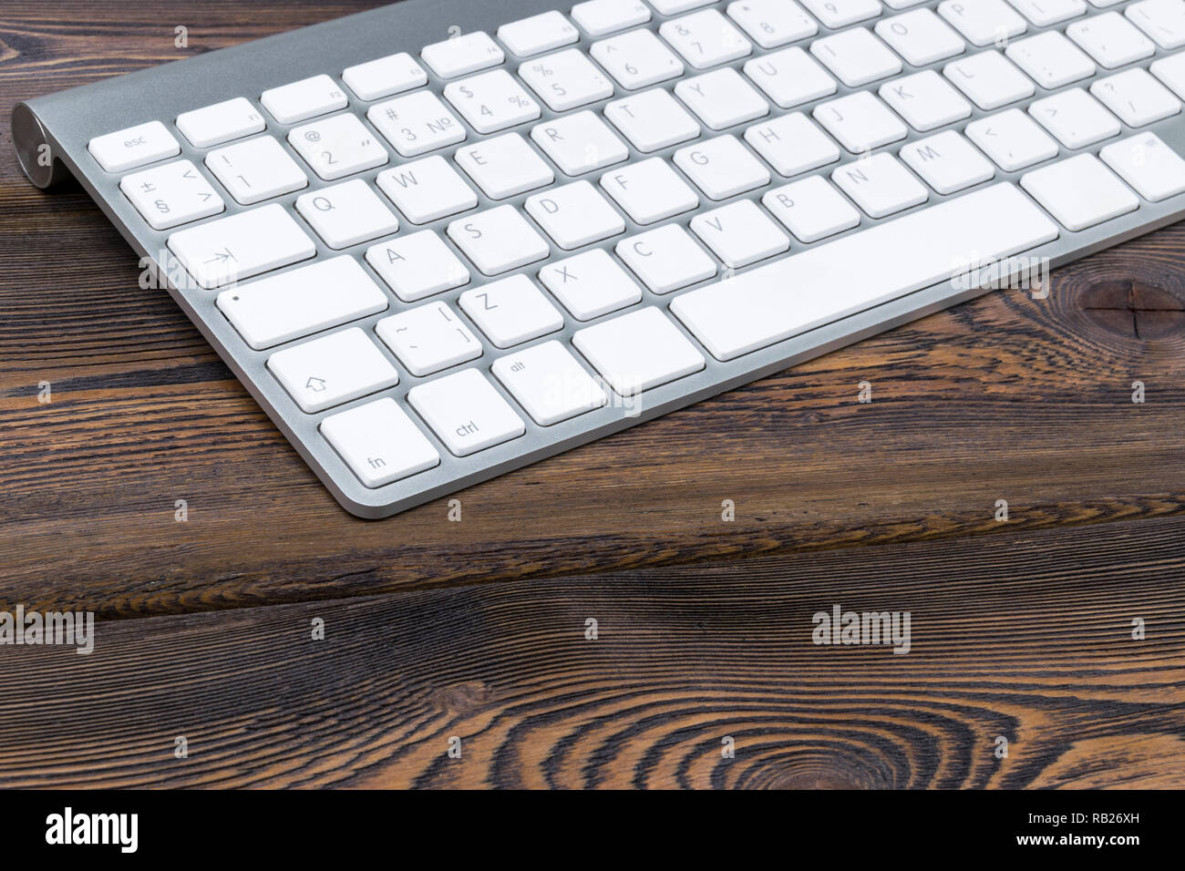 Close up view of a business workplace with wireless computer keyboard ...