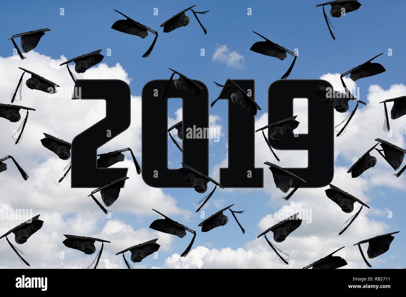 black graduation caps in summer sky with white clouds with year 2019 ...