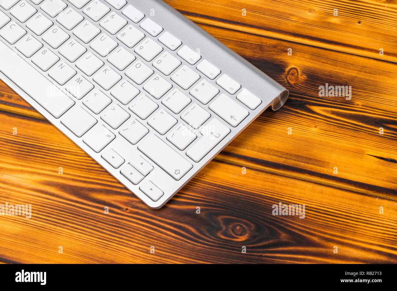 Close up view of a business workplace with wireless computer keyboard ...