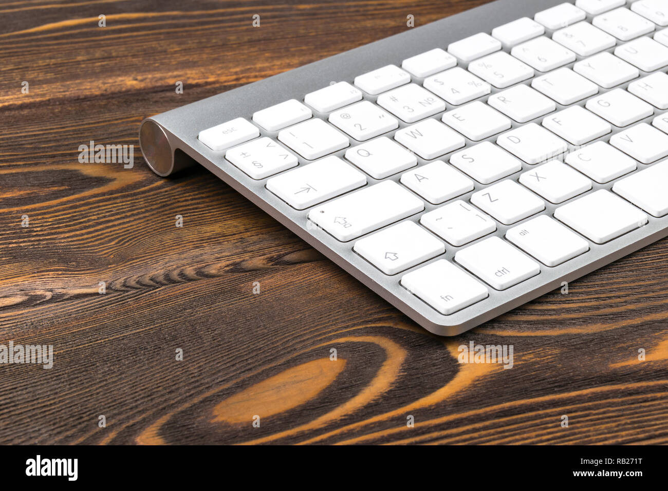 Close up view of a business workplace with wireless computer keyboard ...