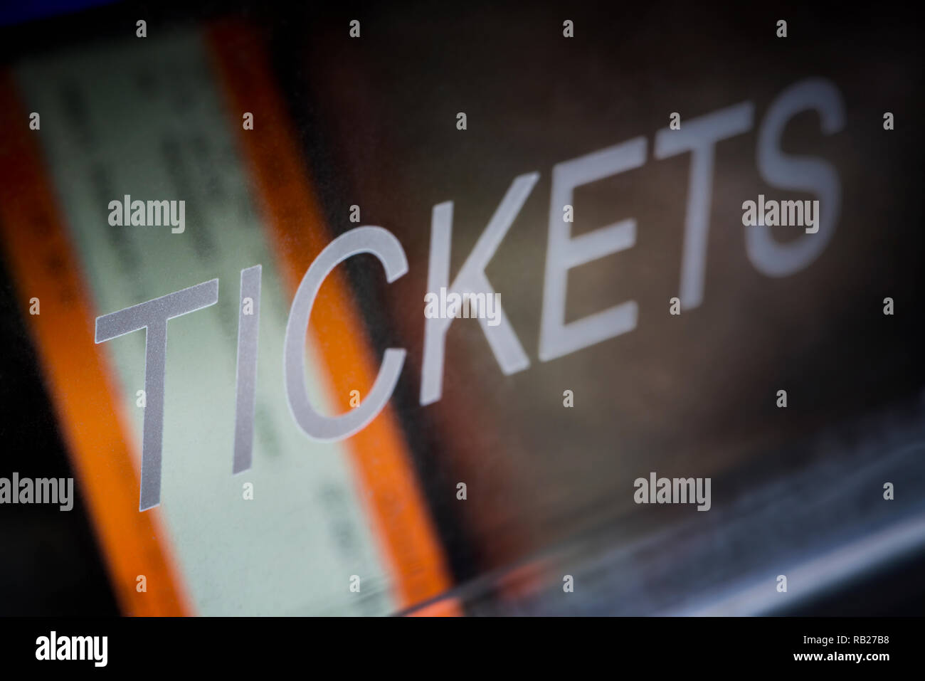 A train ticket awaits collection inside a ticket vending machine ...