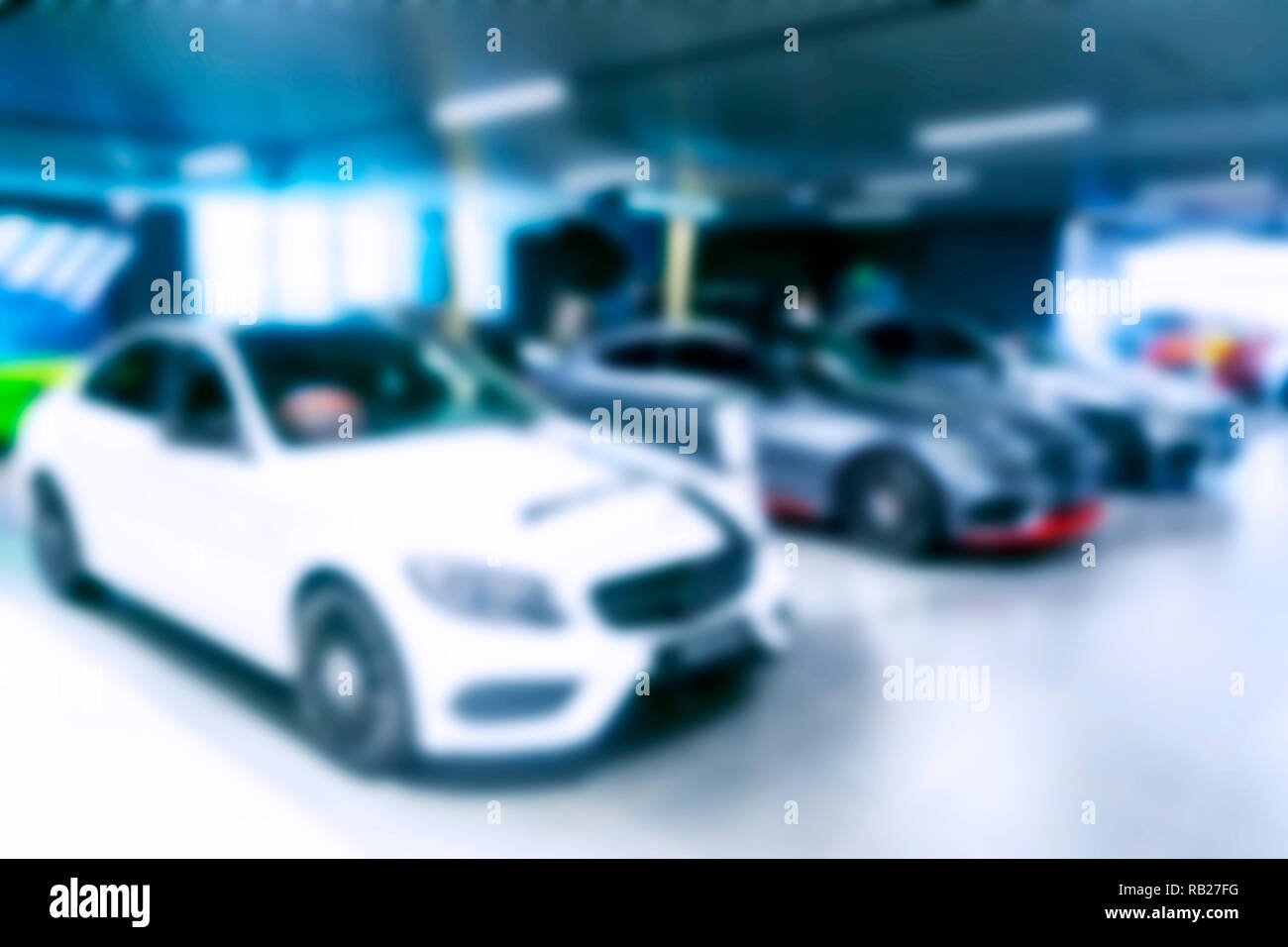 Blurred car dealership store bokeh background. Cars soft lightning ...