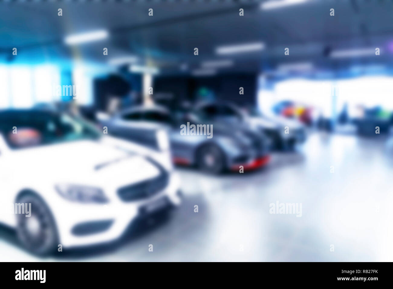 Blurred car dealership store bokeh background. Cars soft lightning ...