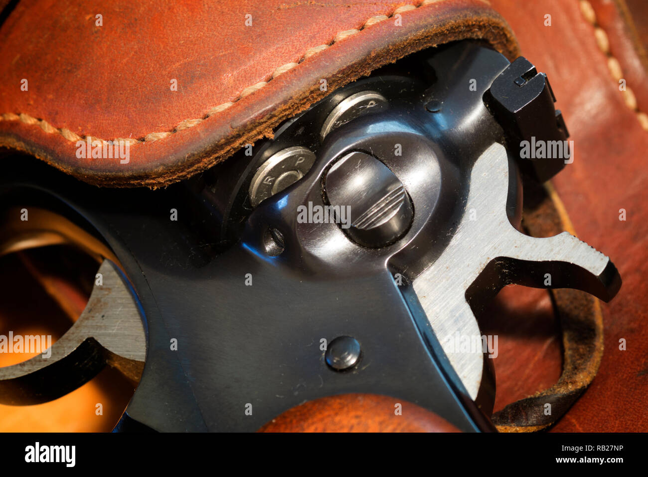 A Ruger Security Six revolver in a leather holster with a bandoleer of ...