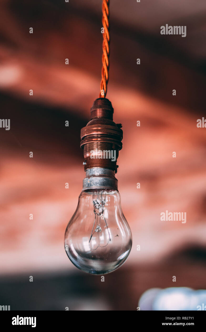 Vintage copper Light bulb in old farm barn Stock Photo - Alamy