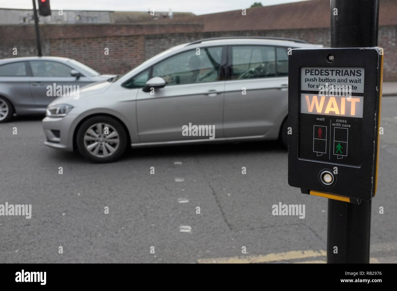 a pedestrian crossing contrl box with wait sign illuminated Stock Photo ...