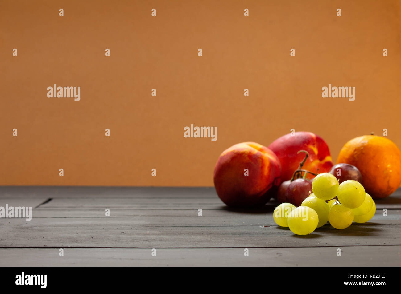 Group of fruits on a rustic background. Fruits of fresh colors Stock ...