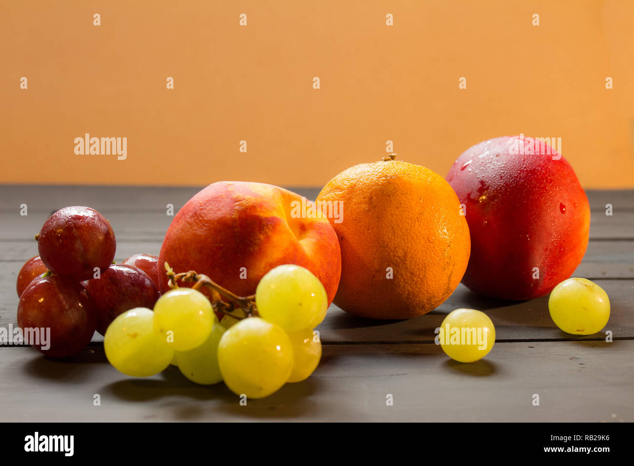 Group of fruits on a rustic background. Fruits of fresh colors Stock ...