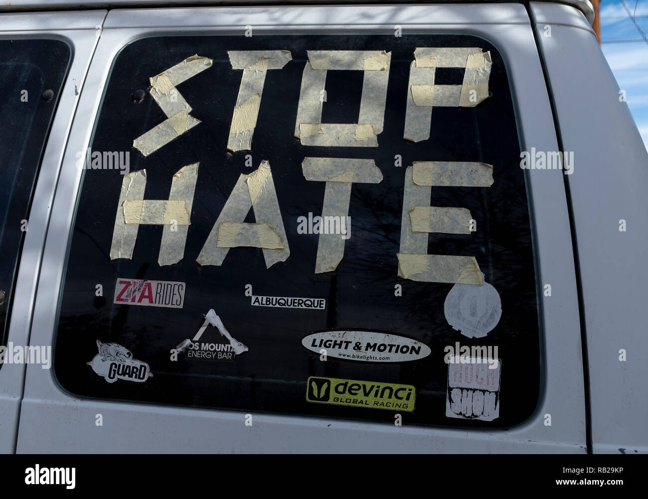 "Stop Hate" taped message on van window Stock Photo - Alamy