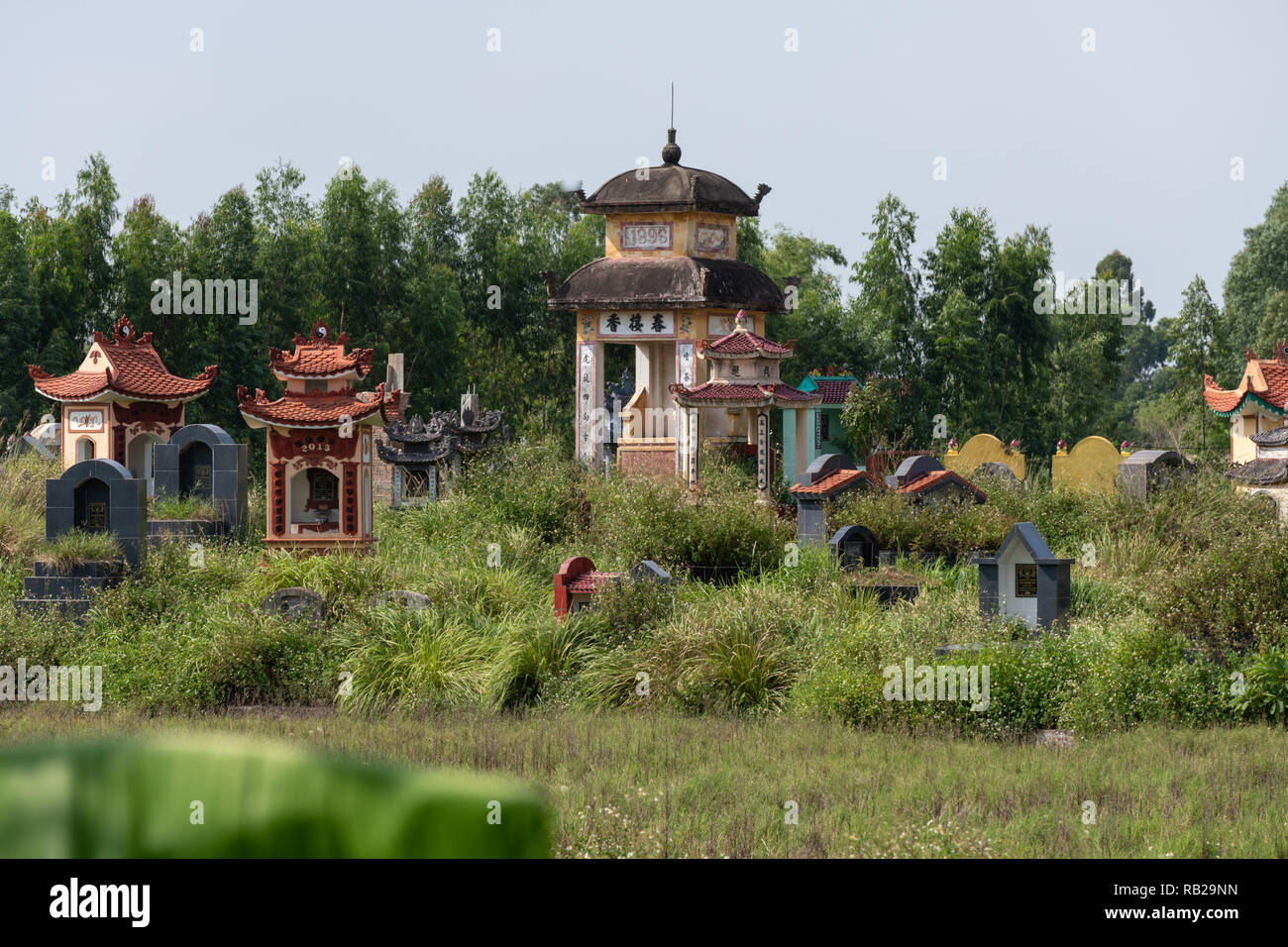 Traditional cemetery, rural Vietnam Stock Photo - Alamy