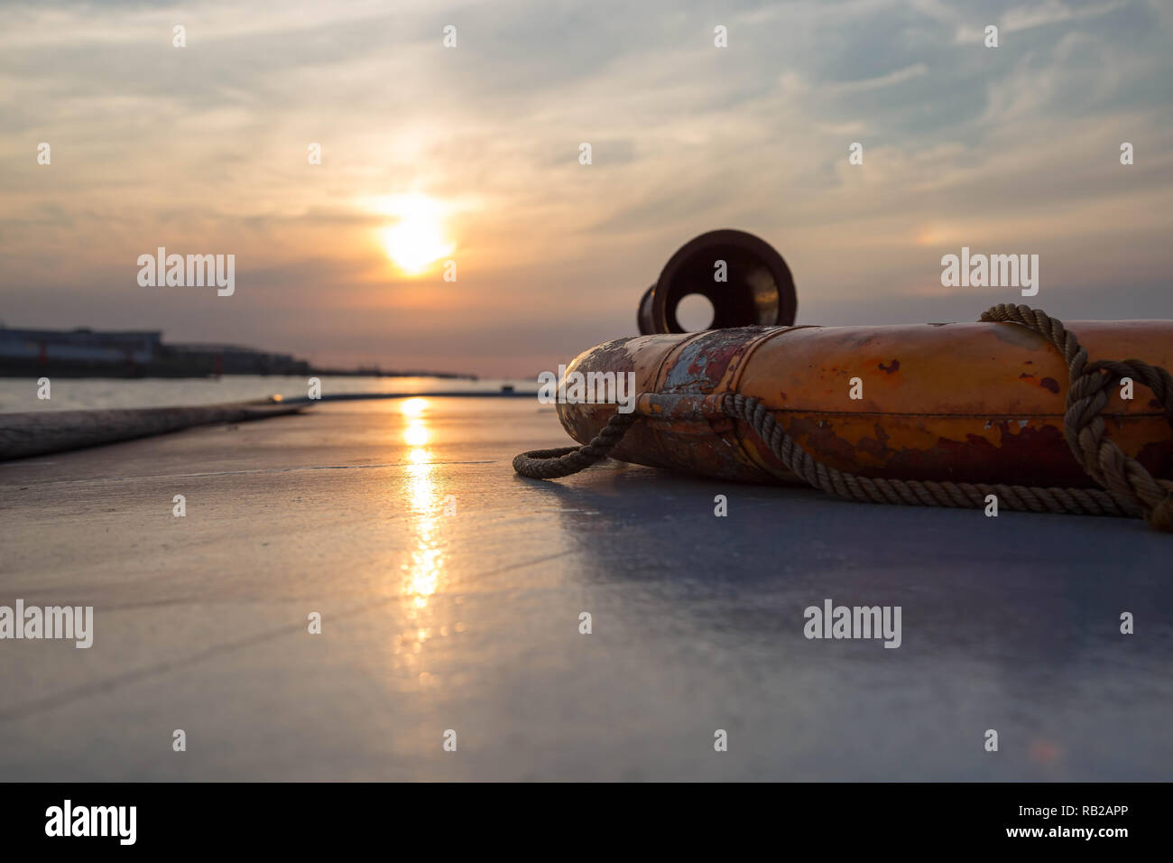 Life belt on ship roof in the sunset Stock Photo - Alamy