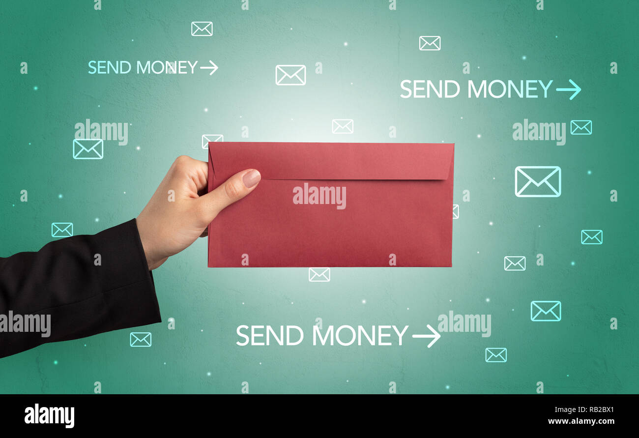 Female hand holding empty and full envelope with green background and ...