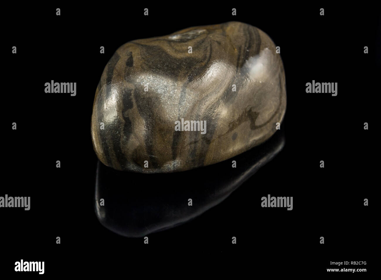 Colorful stone with different designs and colors and black background ...