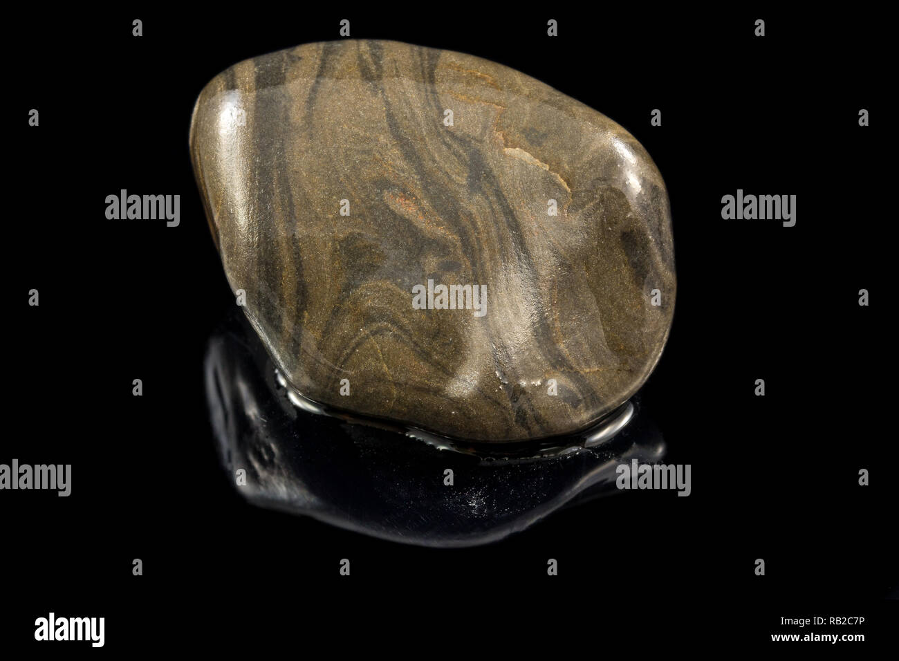 Colorful stone with different designs and colors and black background ...
