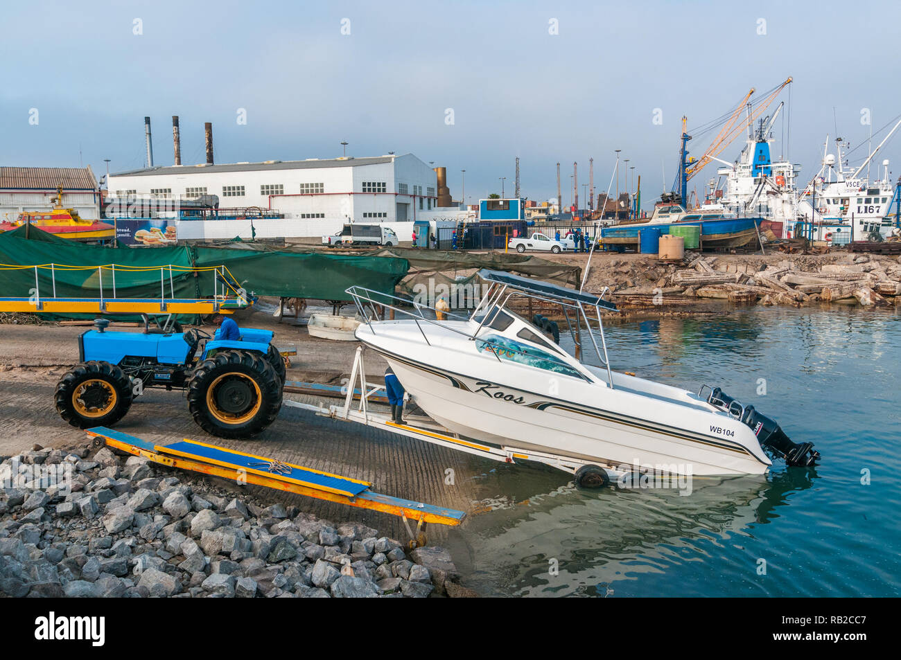 tractor unloading a boat on the water for tourists, Walvis Bay harbour ...