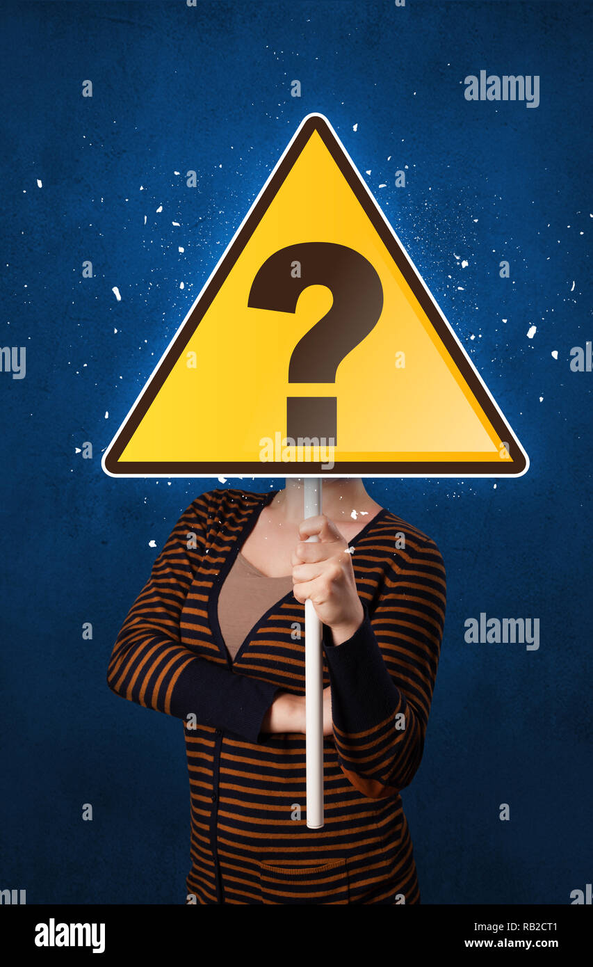 Casual young woman holding yellow sign with question mark Stock Photo ...