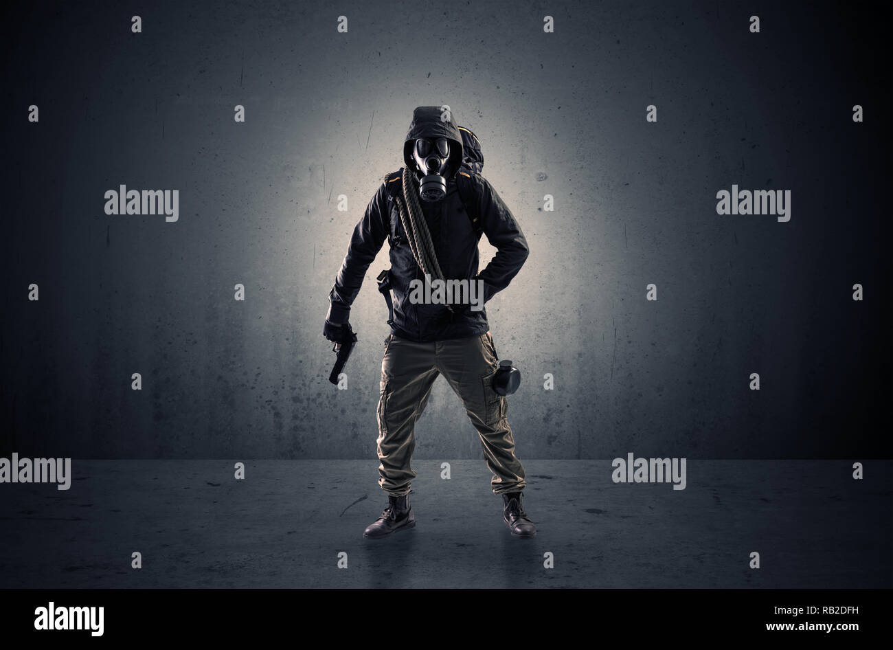 Bad agent in a dark room with arms on his hand and gas mask Stock Photo ...