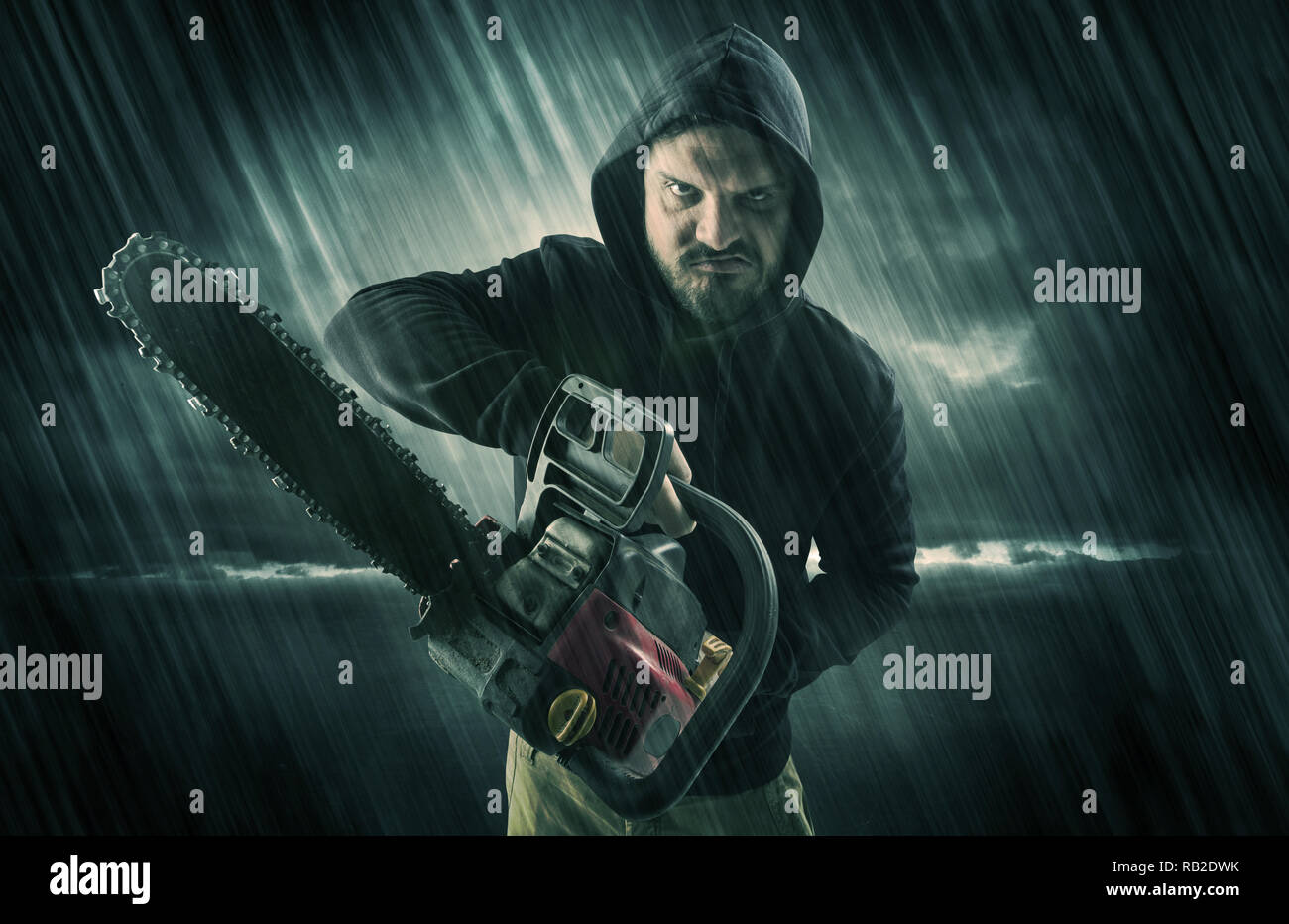 Masked armed poacher in mysterious rainy coastal weather concept Stock ...