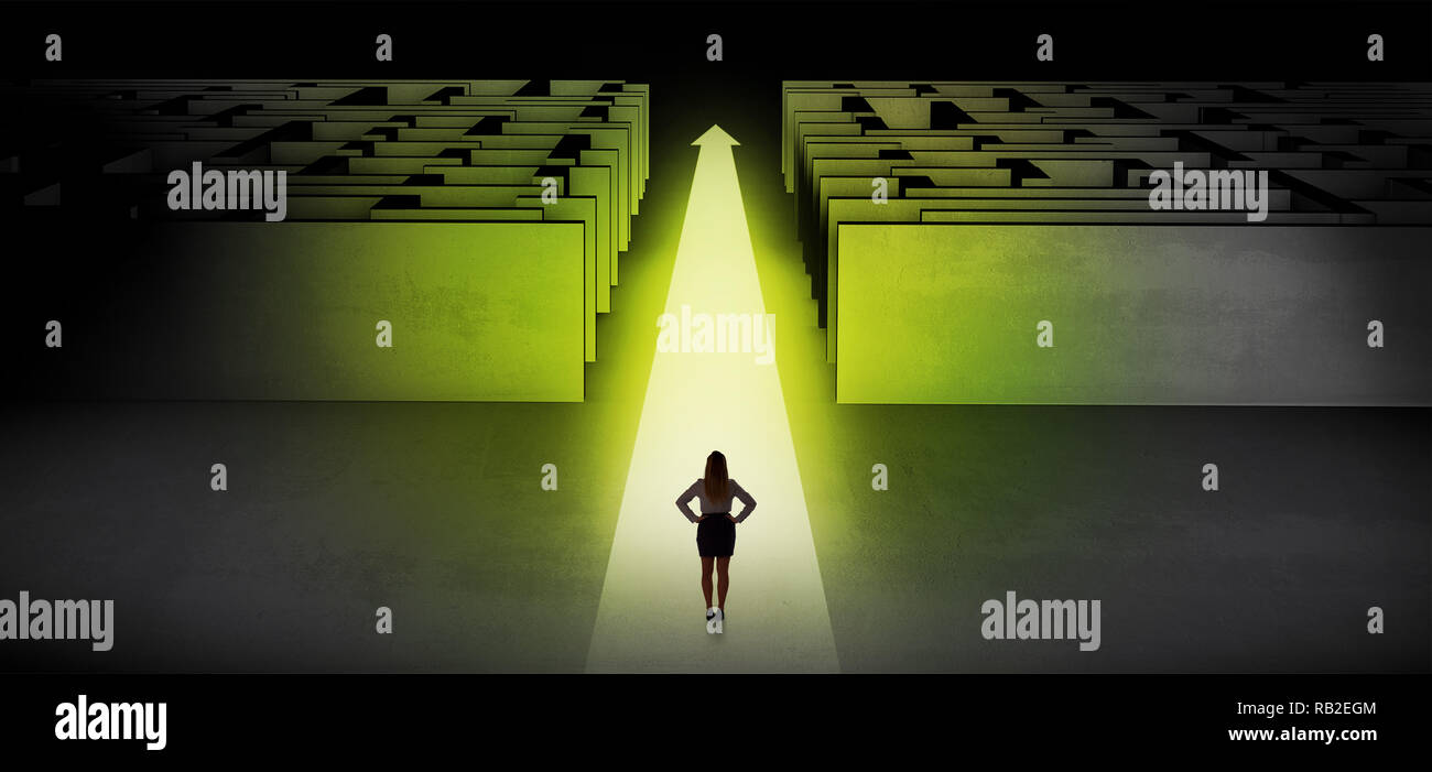 Woman going straight ahead on a lighted carpet arrow between two maze ... Woman going straight ahead on a lighted carpet arrow between two maze ...