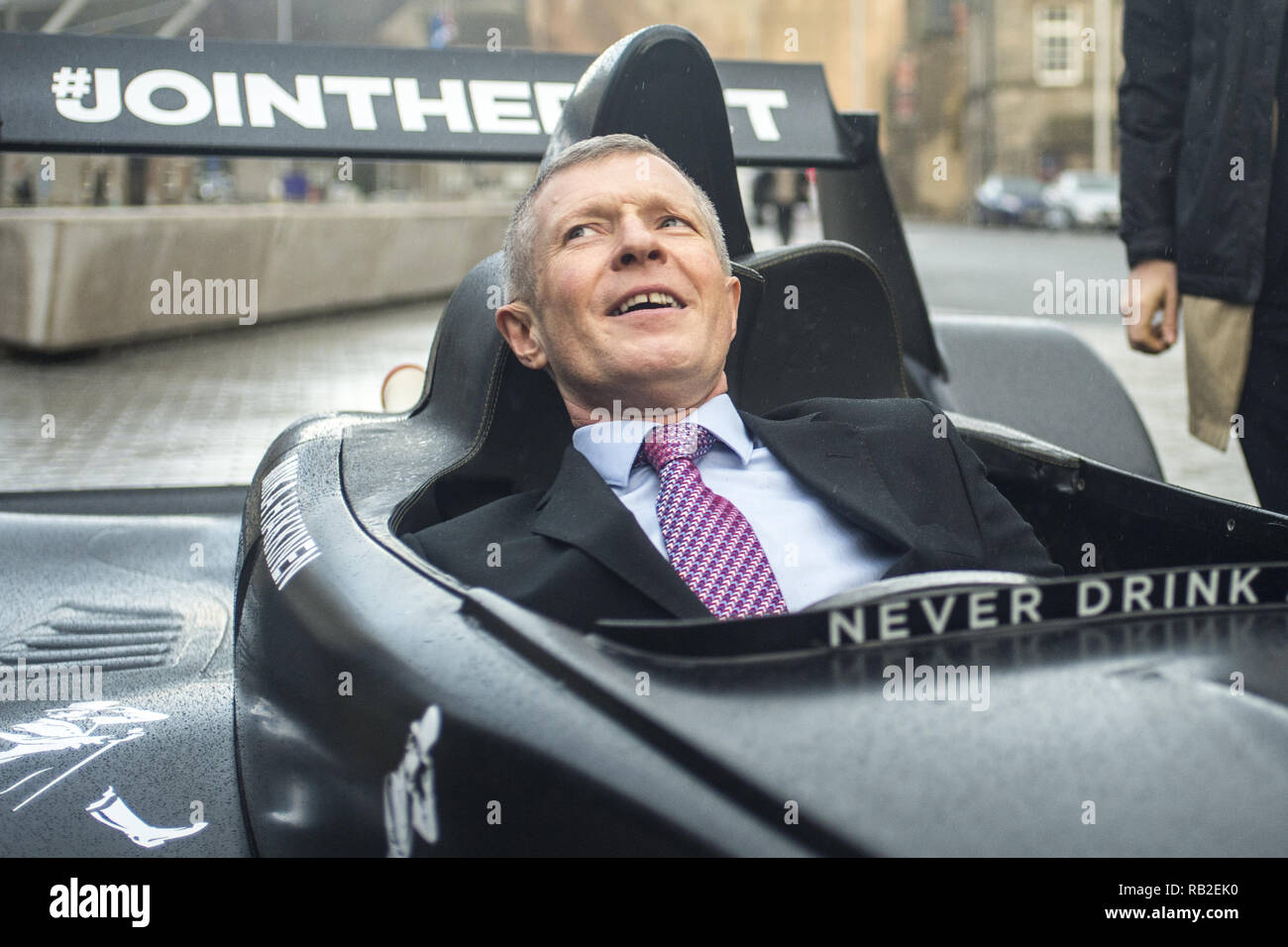 Former professional racing driver Mika Hakkinen poses with the Johnnie ...
