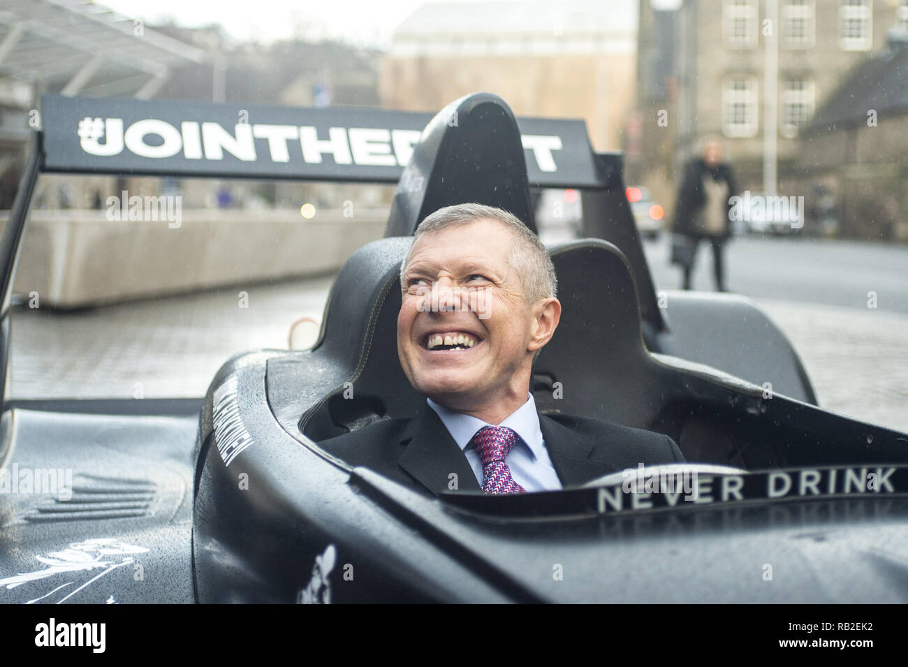 Former professional racing driver Mika Hakkinen poses with the Johnnie ...