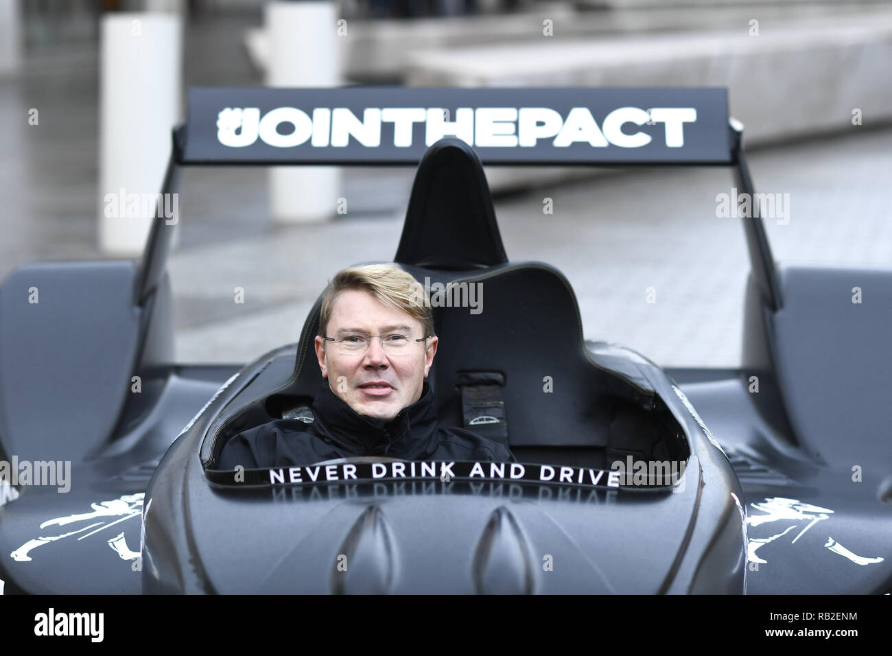 Former professional racing driver Mika Hakkinen poses with the Johnnie ...