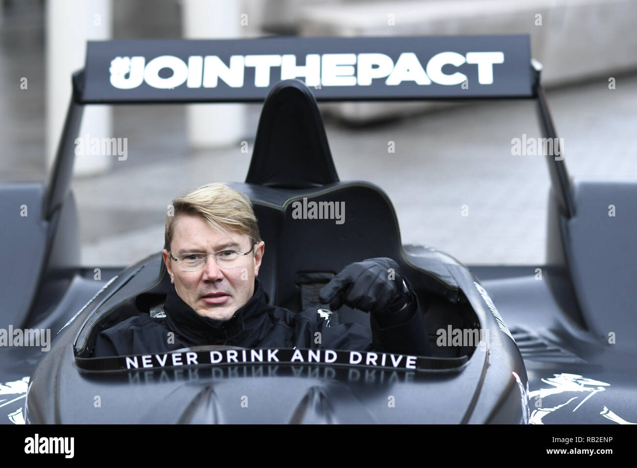 Former professional racing driver Mika Hakkinen poses with the Johnnie ...