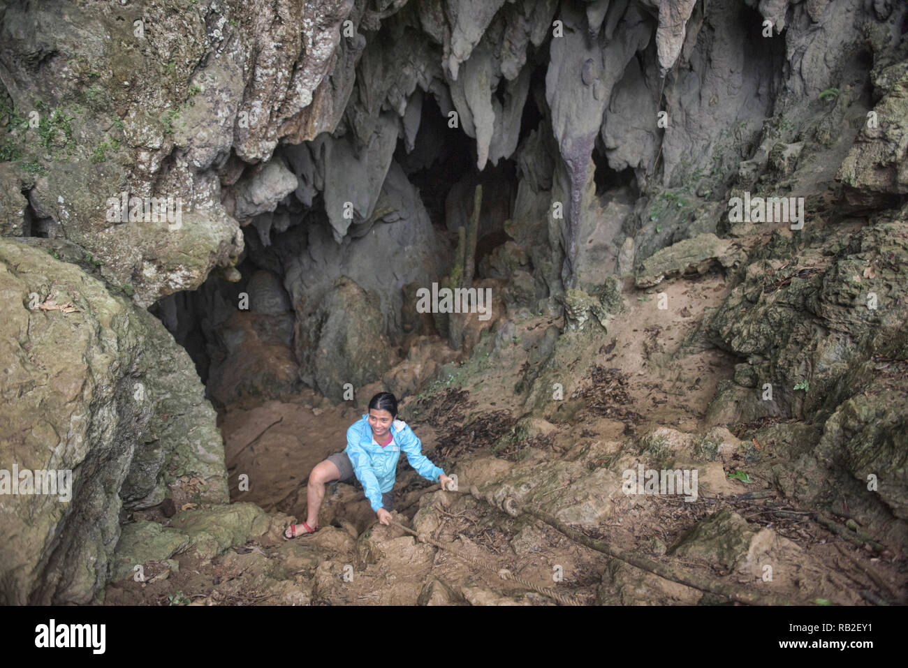 Climbing out of the Lussok Cave and underground river, Luna, Apayao ...