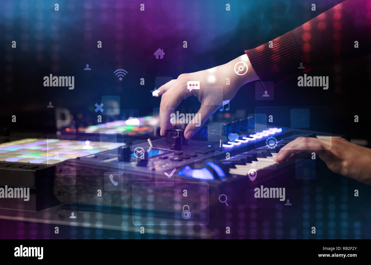 Hand mixing music on dj controller with social media concept icons ...