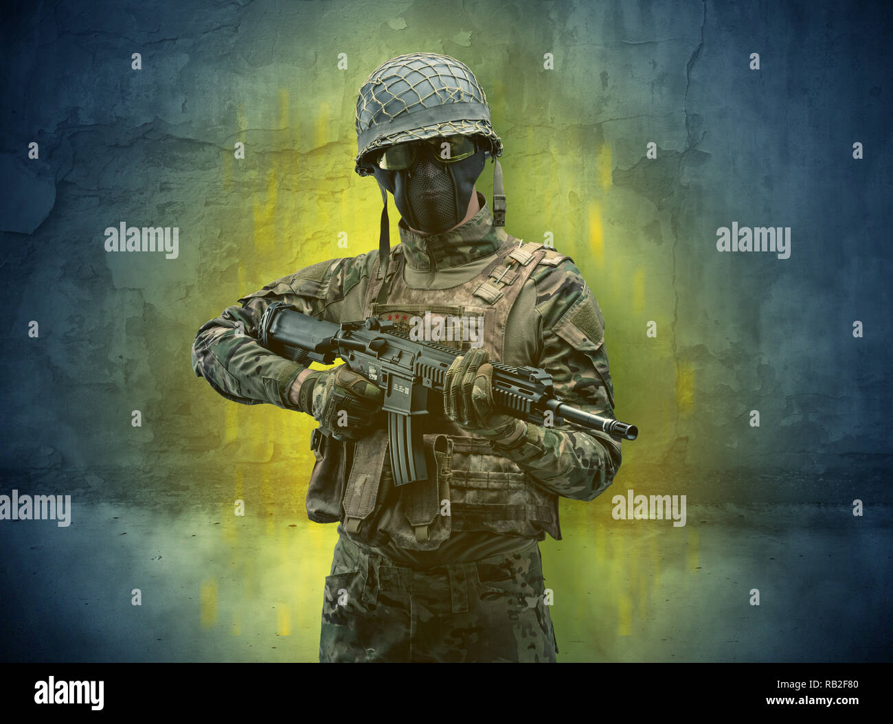 Hazard, menace soldier in a ruined crumbly building with arms on his ...