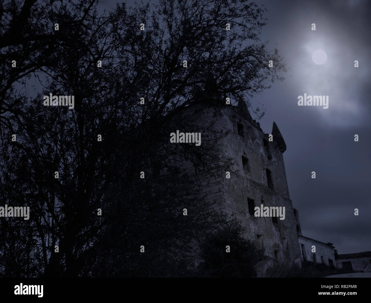 Creepy medieval tower in an overcast full moon night Stock Photo - Alamy