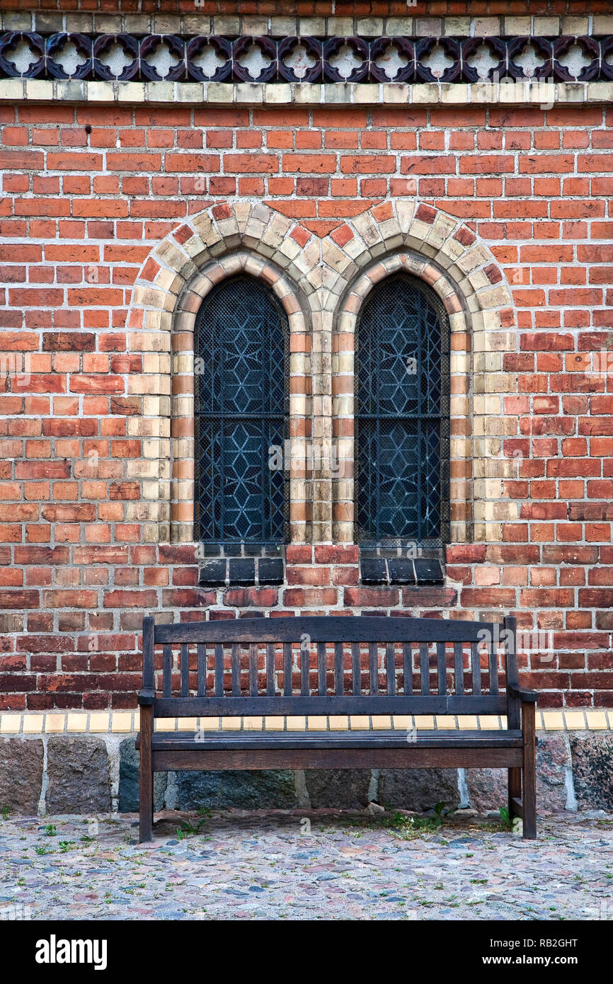 Empty bench at an old church Stock Photo - Alamy