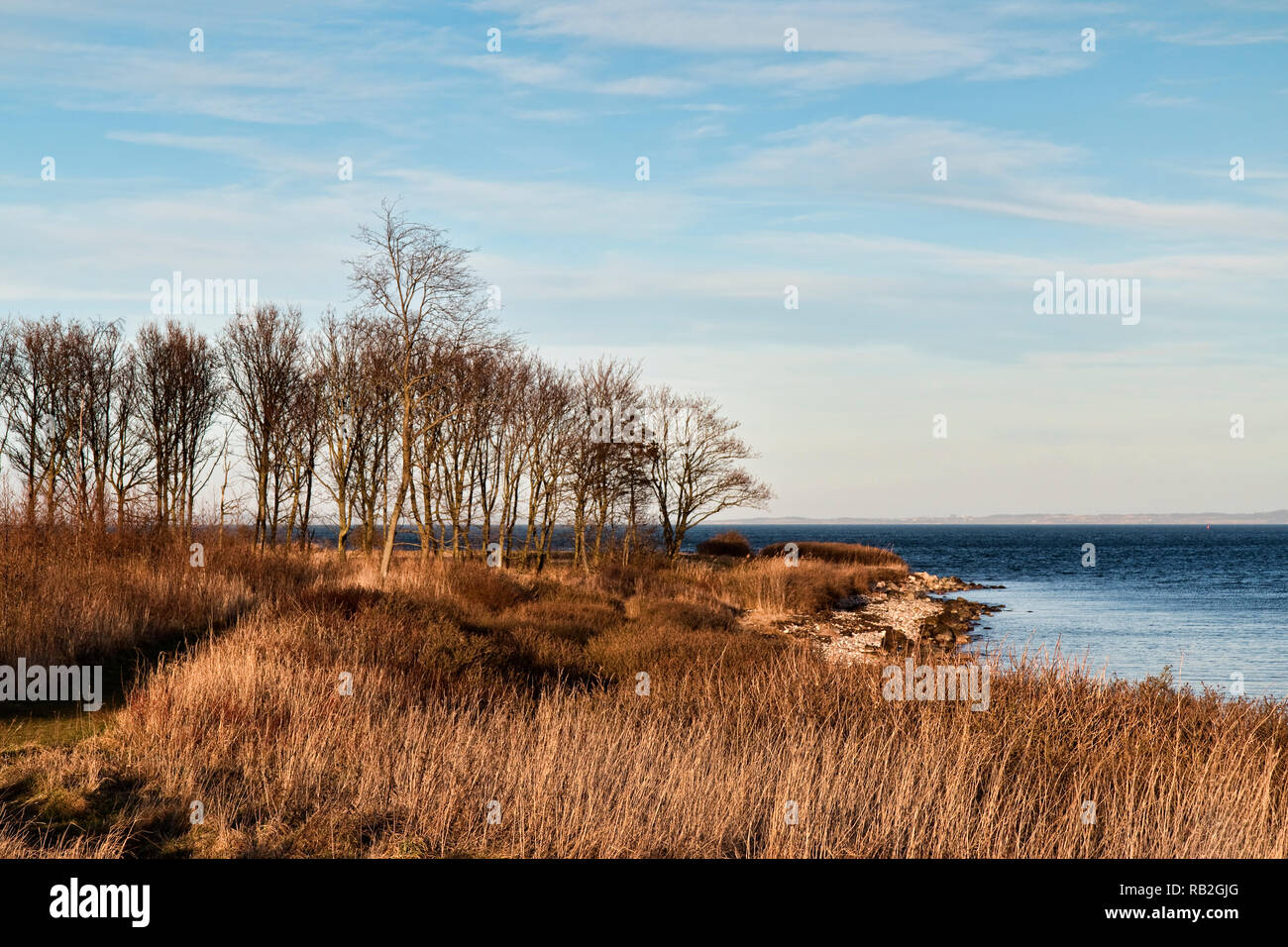 Sunset at a coast at fall. Can be used as background Stock Photo - Alamy