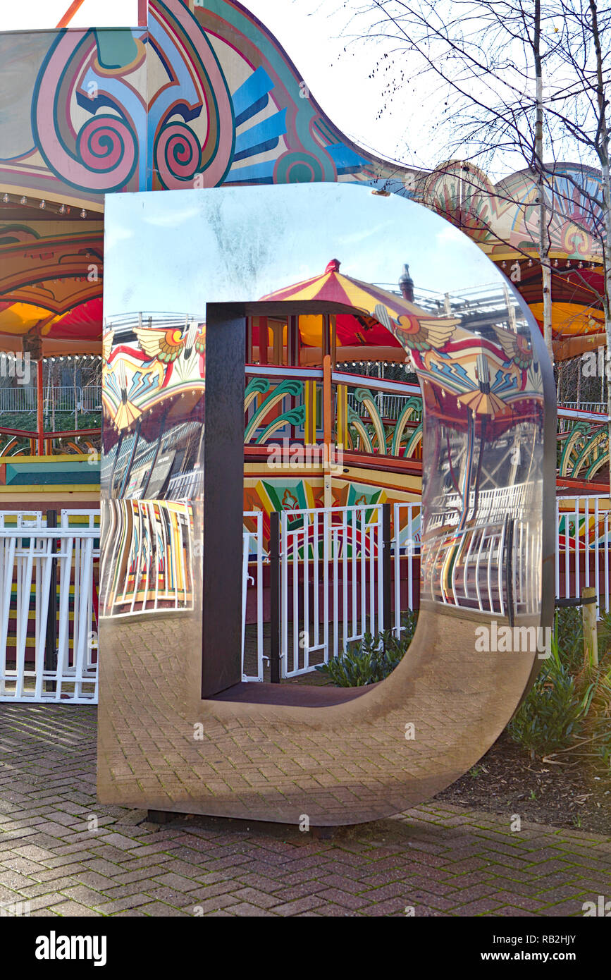 Reflection in a Shiny mirrored letter D at margate dreamland Stock ...