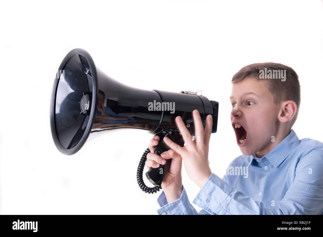 Boy calls into a megaphone with his mouth ripped open isolated on white ...