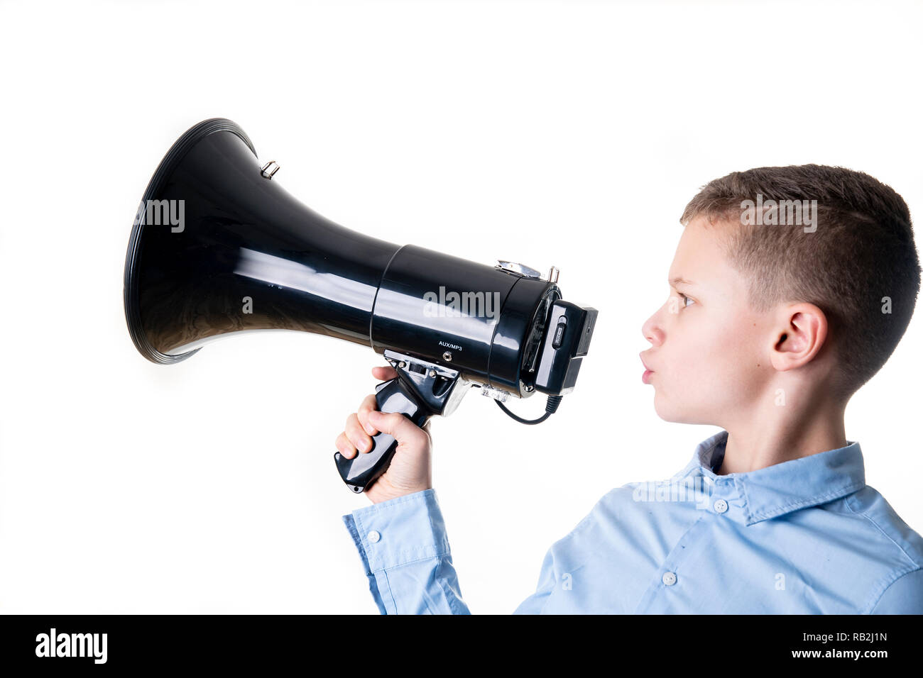 Boy calls into a megaphone with his mouth ripped open isolated on white ...