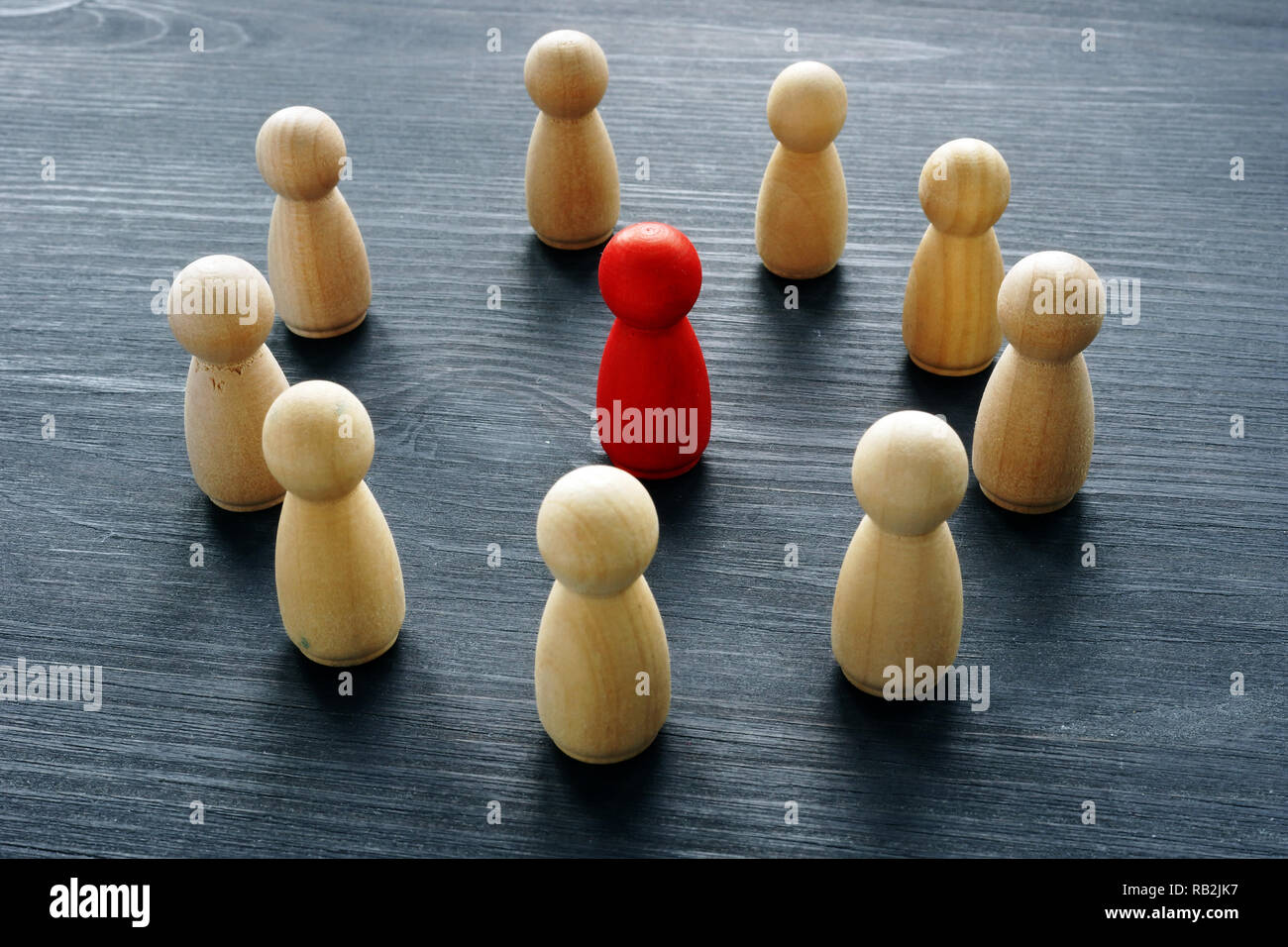 Leadership in the business team. Wooden figures on a desk Stock Photo ...