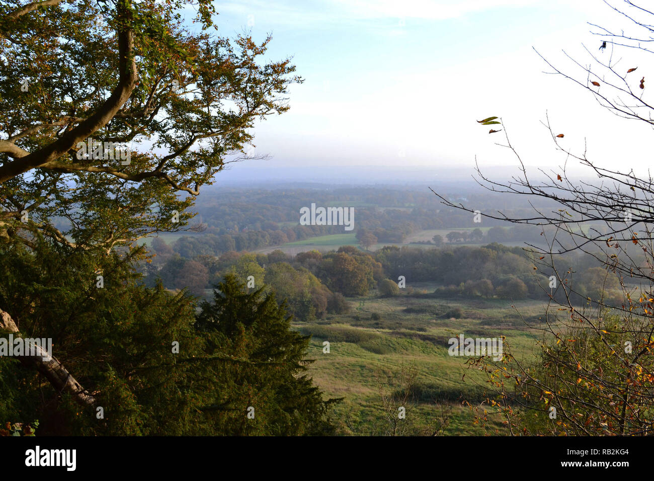 Misty autumn view to the Low Weald of Kent from Wilmots Hill and the ...