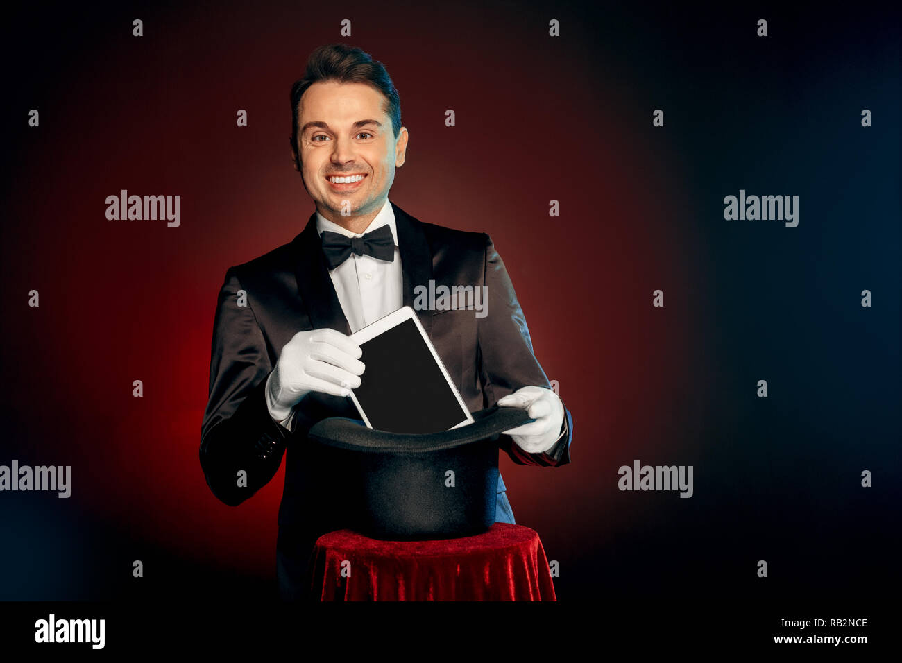 Professional Occupation. Magician in suit and gloves standing isolated ...