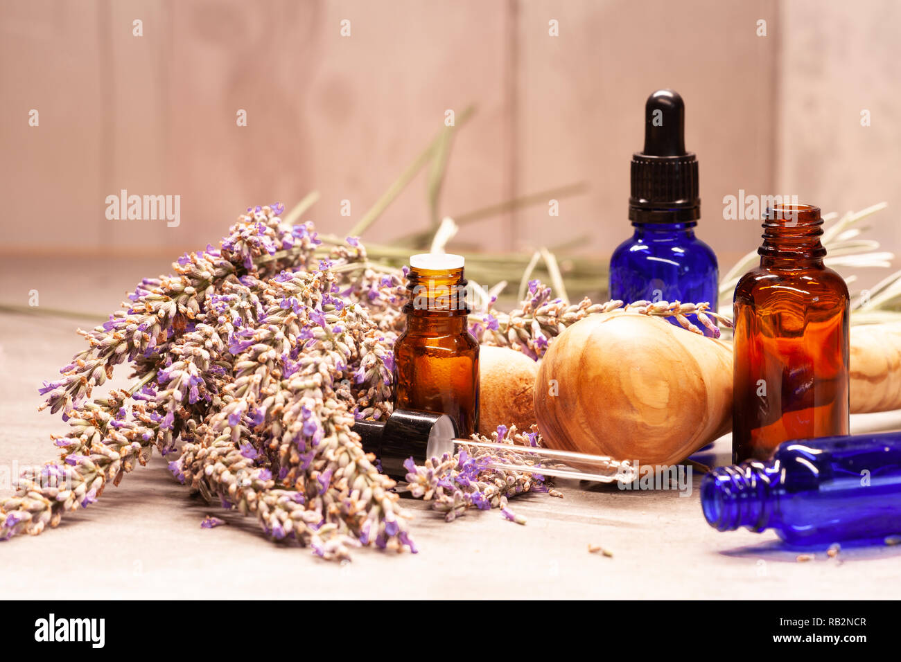 lavender mortar and pestle and bottles of essential oils for aromatherapy Stock Photo - Alamy