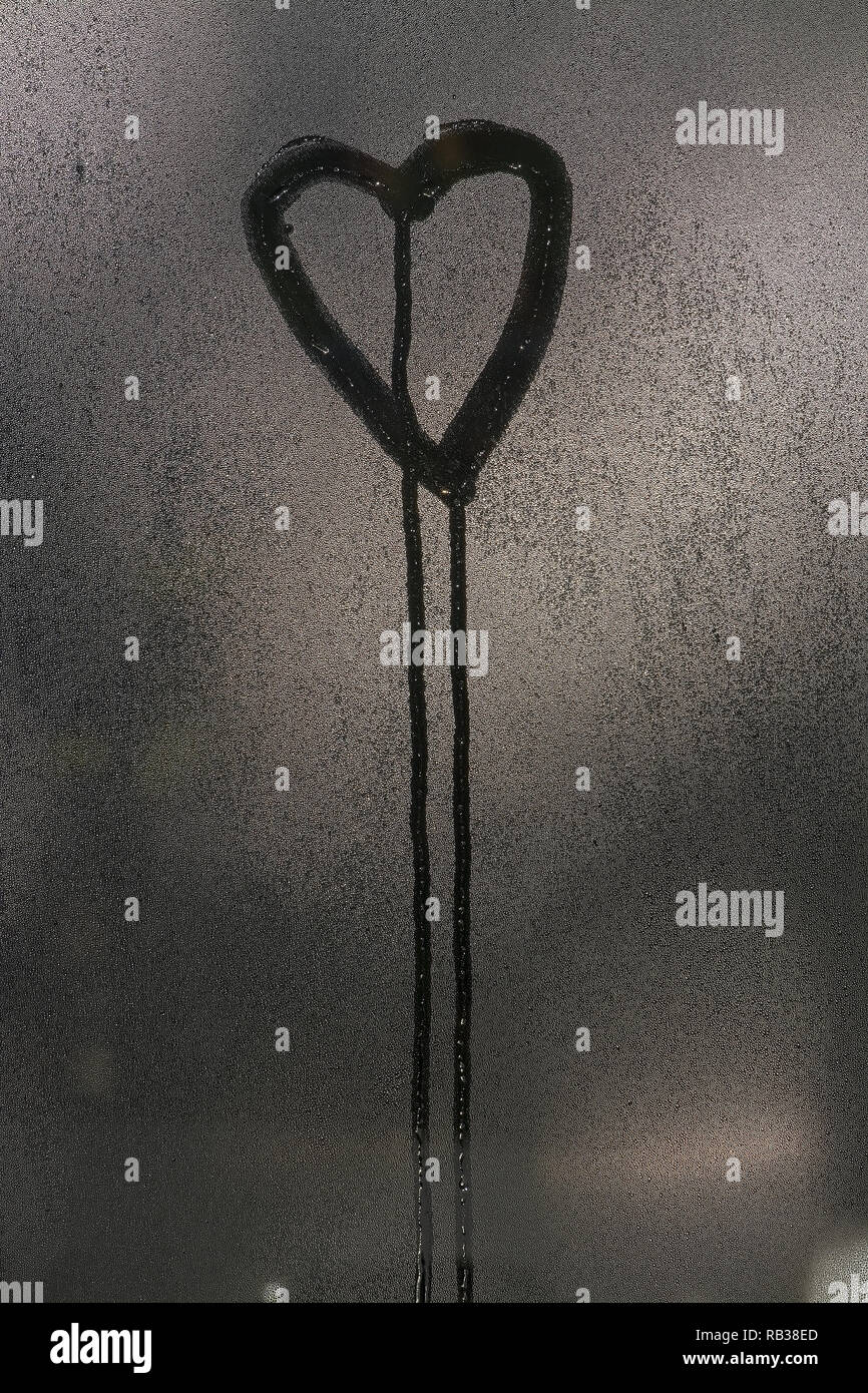 Window dew and drawn heart shape with running drops Stock Photo - Alamy