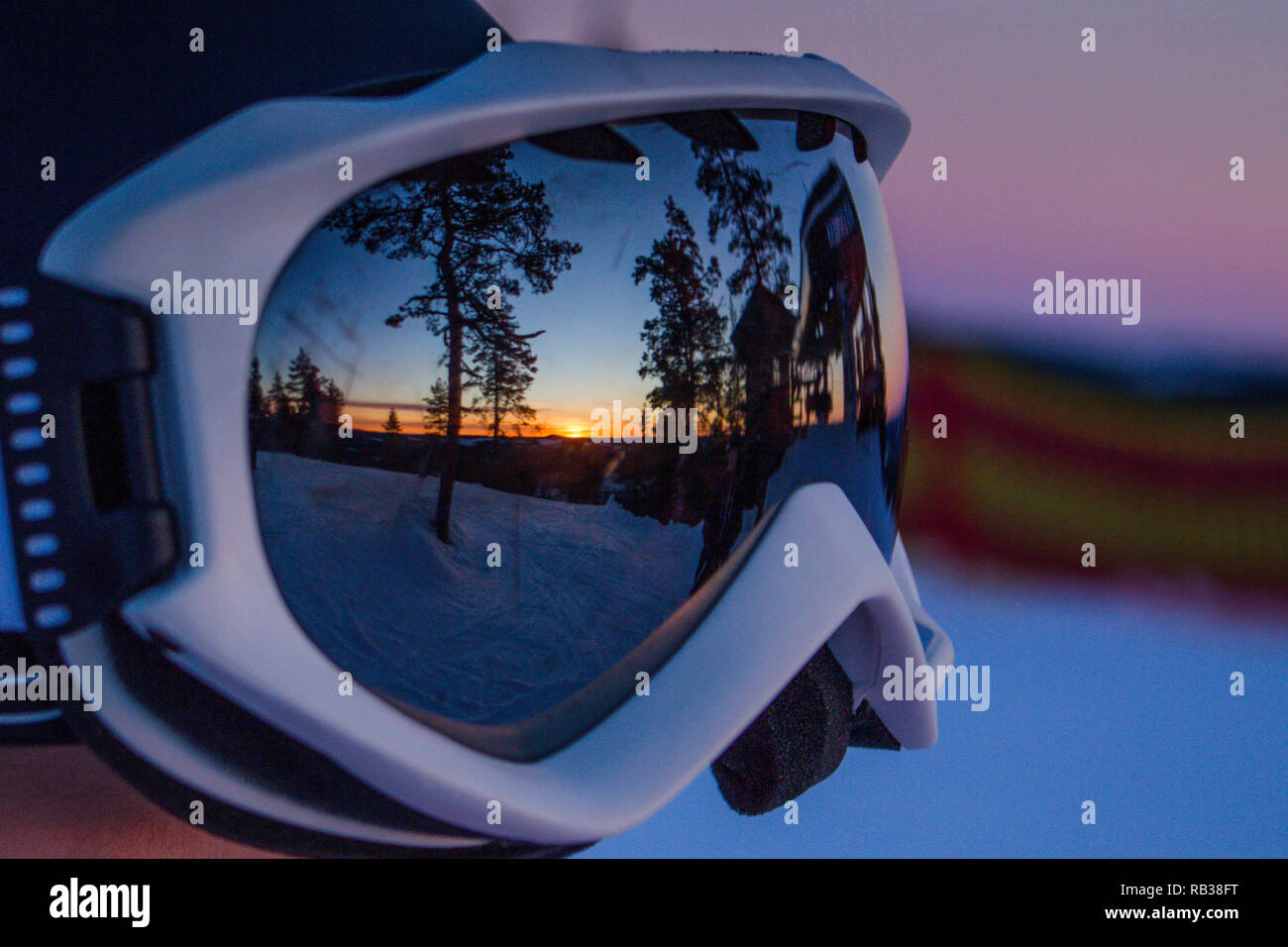 Ski goggles with a sunset reflection Stock Photo - Alamy