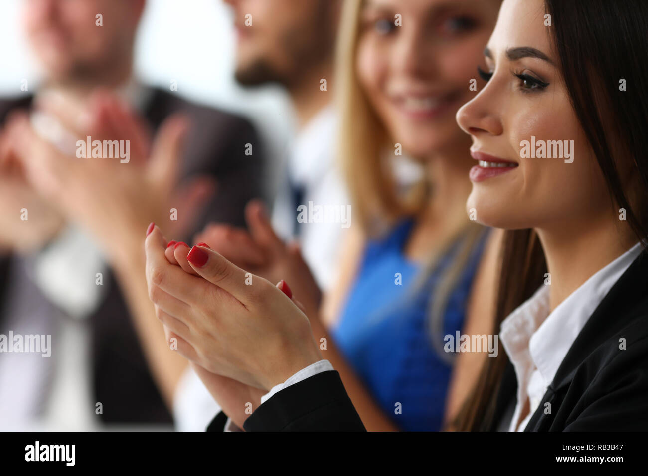 Group of people clap their arm in row Stock Photo - Alamy