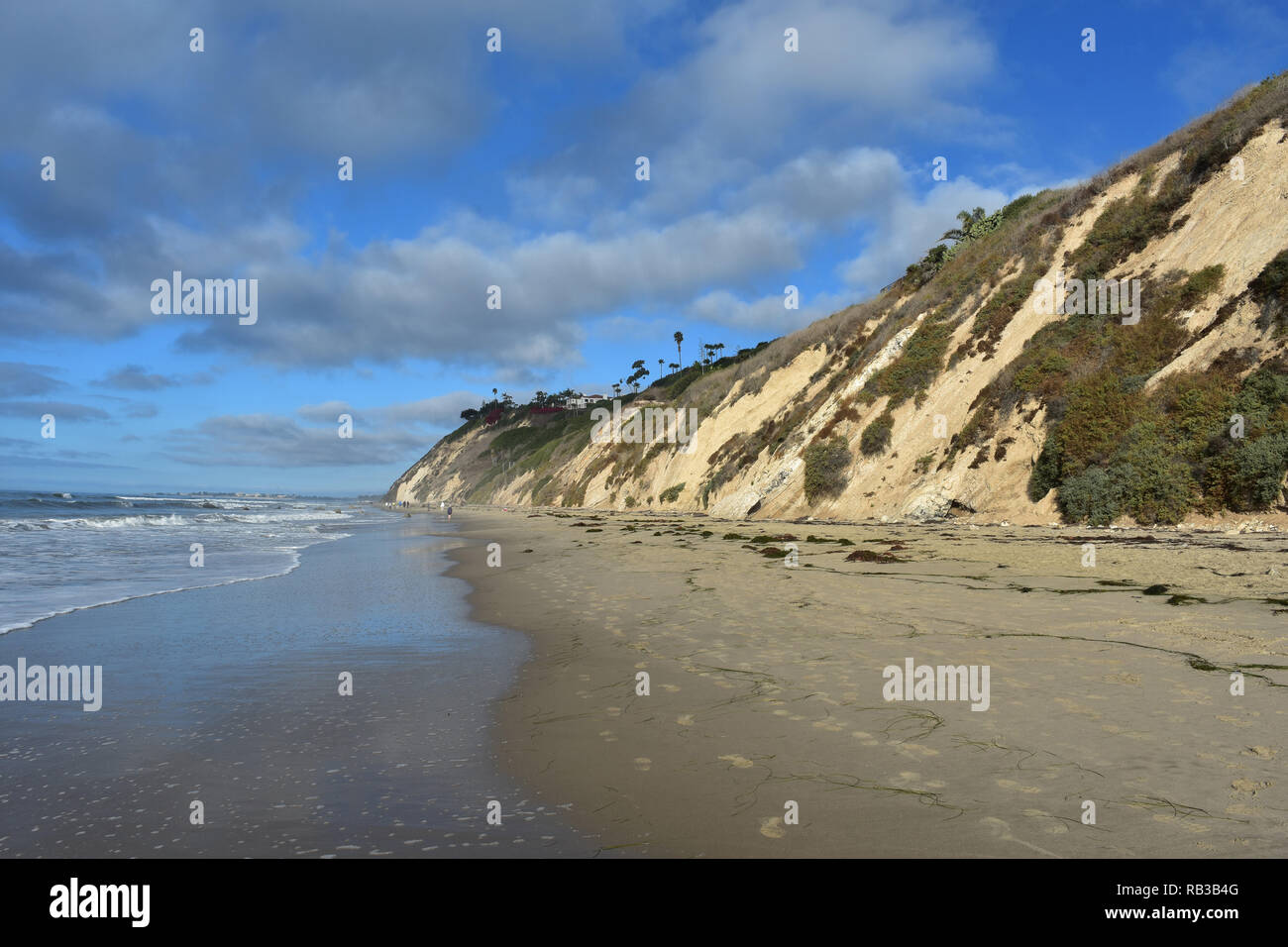 Beautiful beach with tall cliffs Stock Photo - Alamy