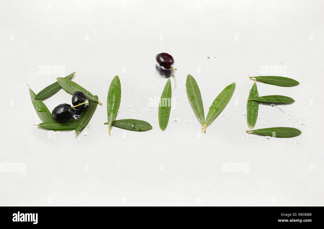 olive letters made with olive oil and olive leaves Stock Photo - Alamy