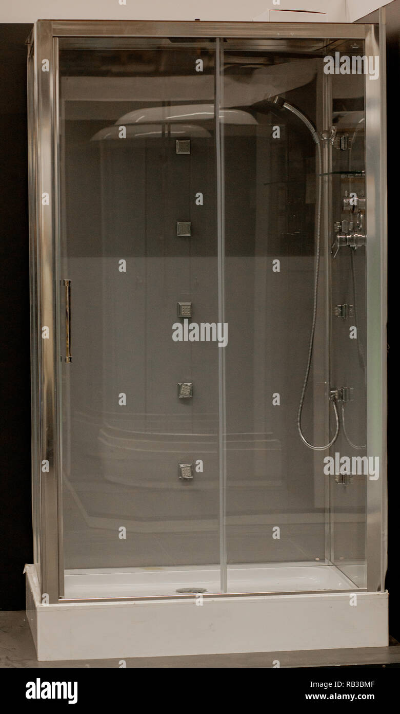 Modern and big shower cabin in bathroom corner Stock Photo - Alamy