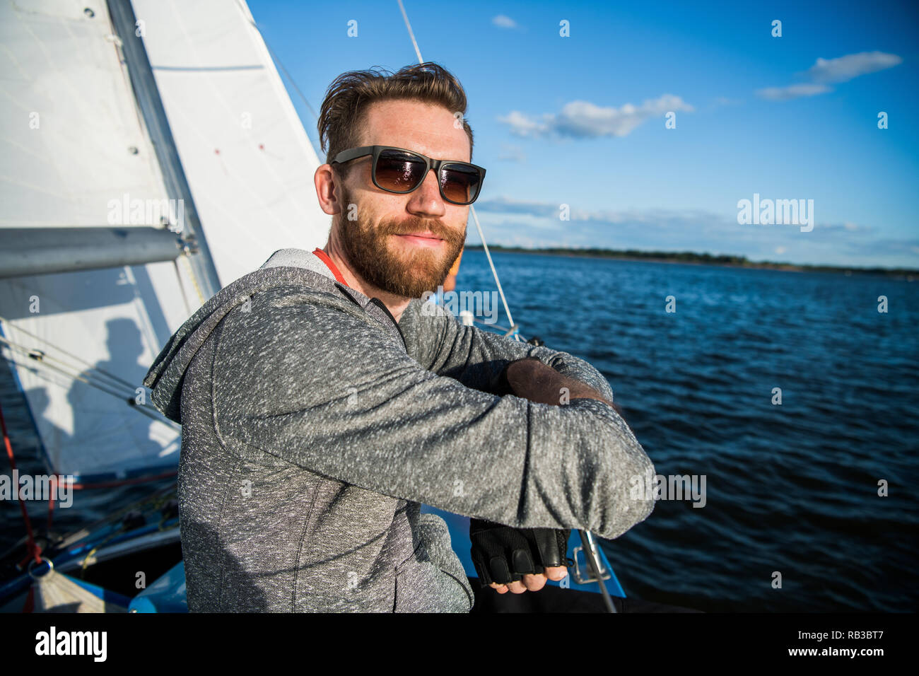 Nice happy bearded man sailor thumbing up and evincing positivity while ...
