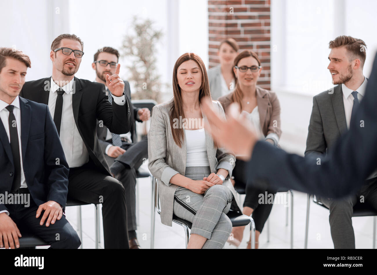 leader of the business people giving a speech in a conference room ...