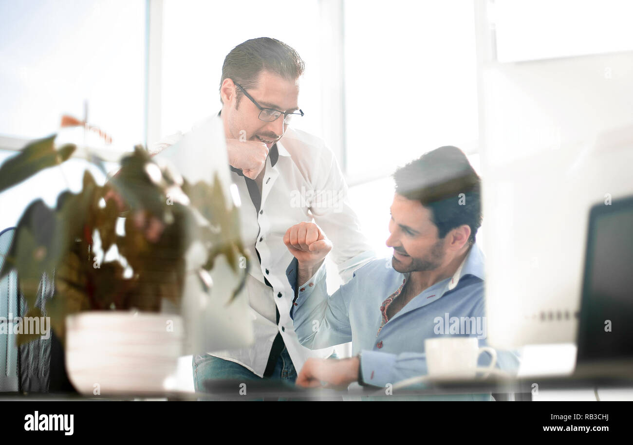 business background.Two smiling male colleagues giving fist bumps Stock ...