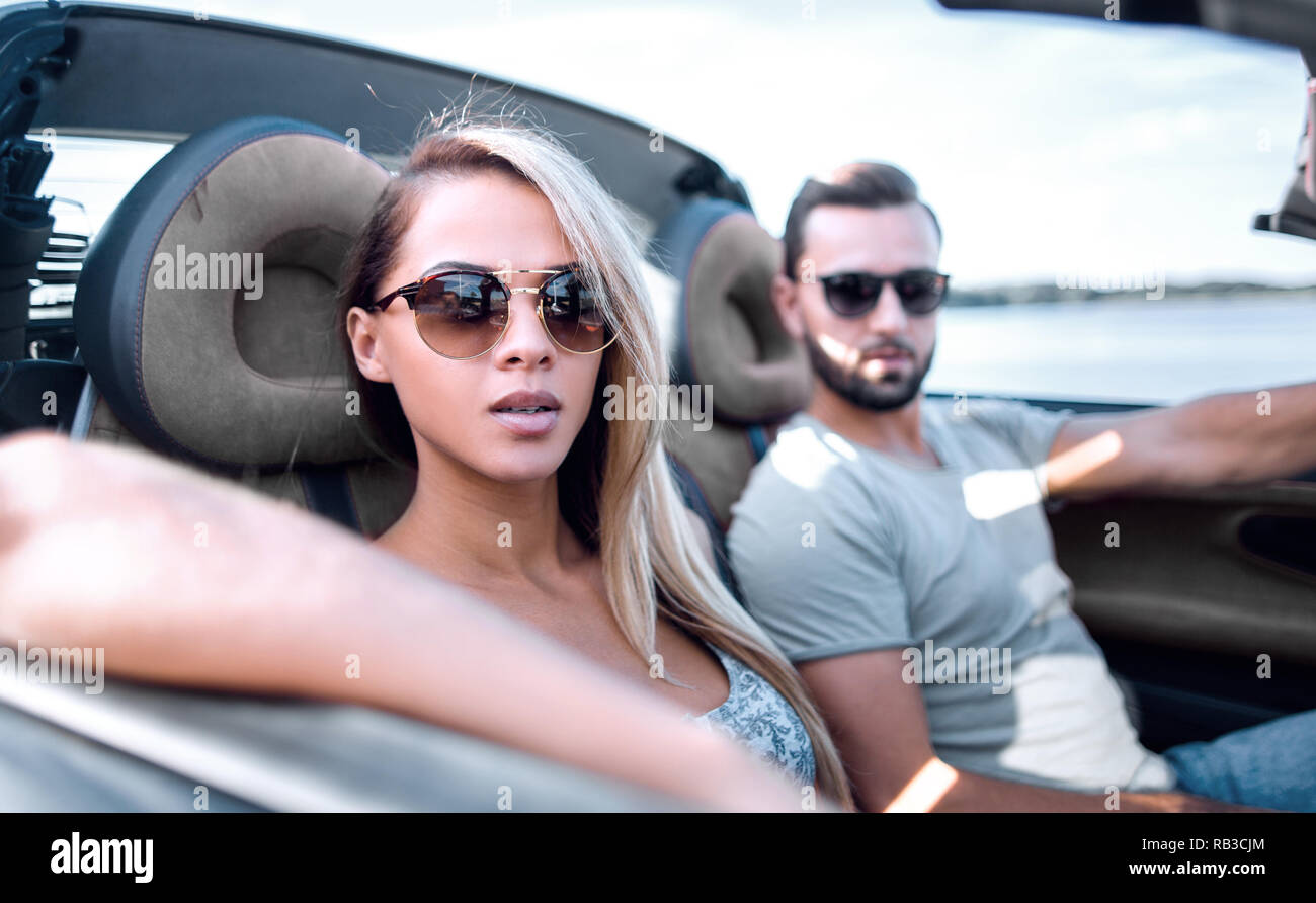 close up.the couple traveling in a convertible Stock Photo - Alamy